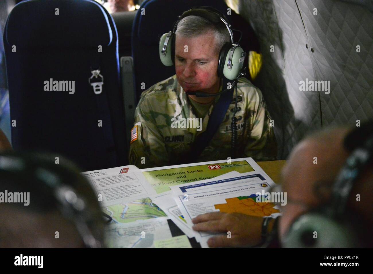 U.S. Army Corps of Engineers Colonel Michael Clancy reviews maps and ...