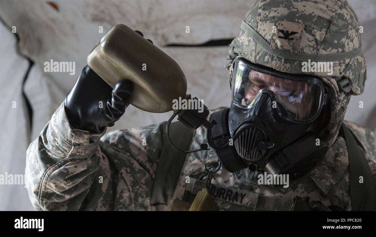 U.S. Army Col. Clinton Murray, assigned to 20th CBRNE Command, hydrates ...