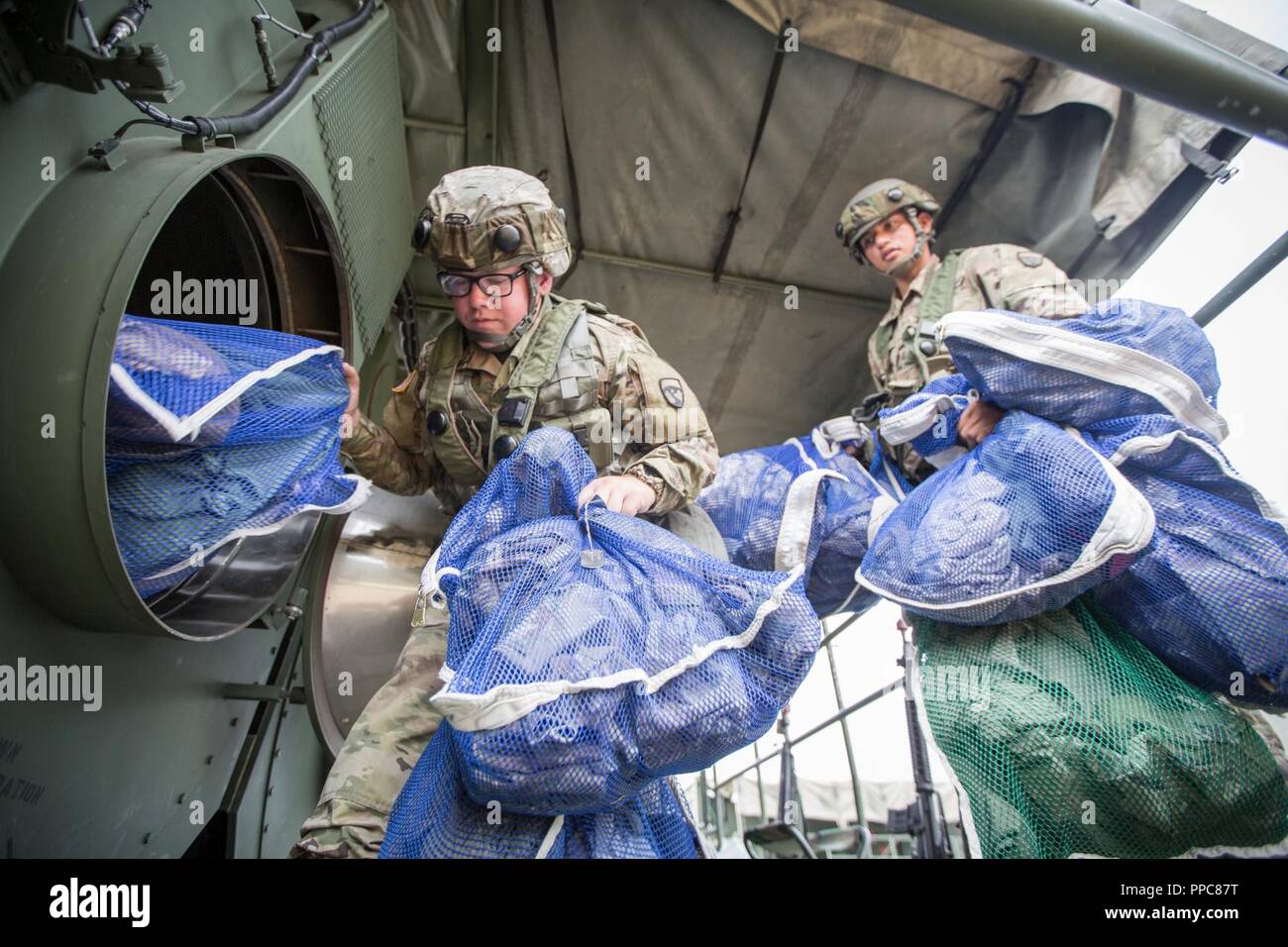 U.S. Army Reserve Pfc. Michael Birkett (left), and Pvt. Brian Arzate ...