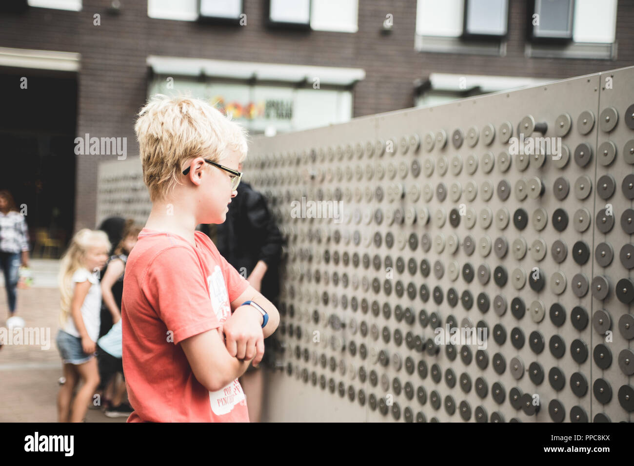 Playing on slides hi-res stock photography and images - Alamy