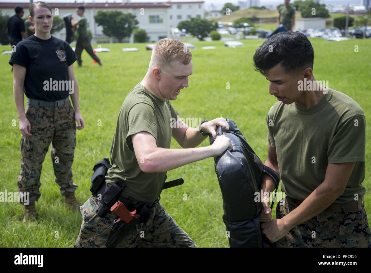 CAMP FOSTER, OKINAWA, Japan – Provost Marshal Office Marines perform ...