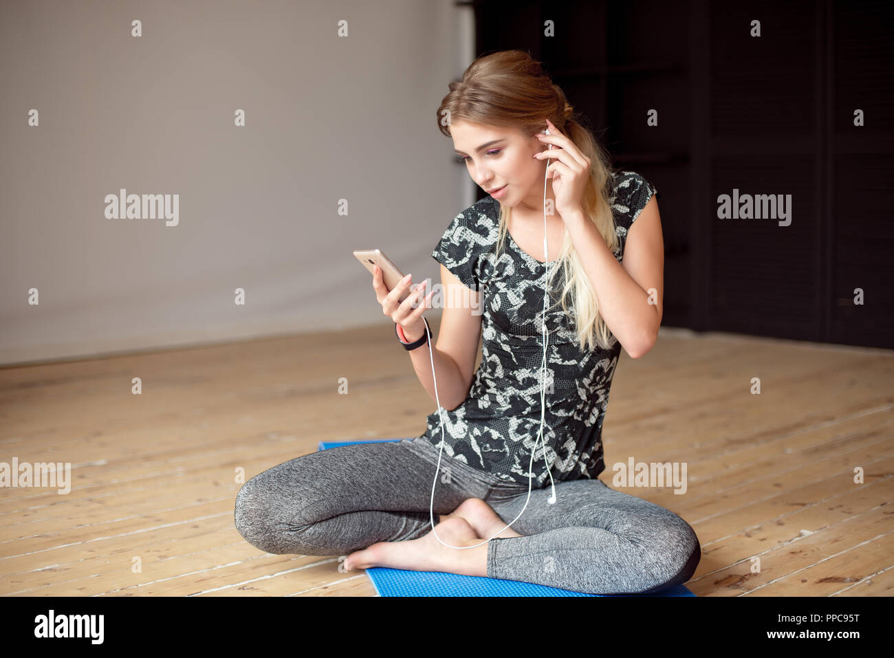 Young woman happy singing her favorite song while listening music ...