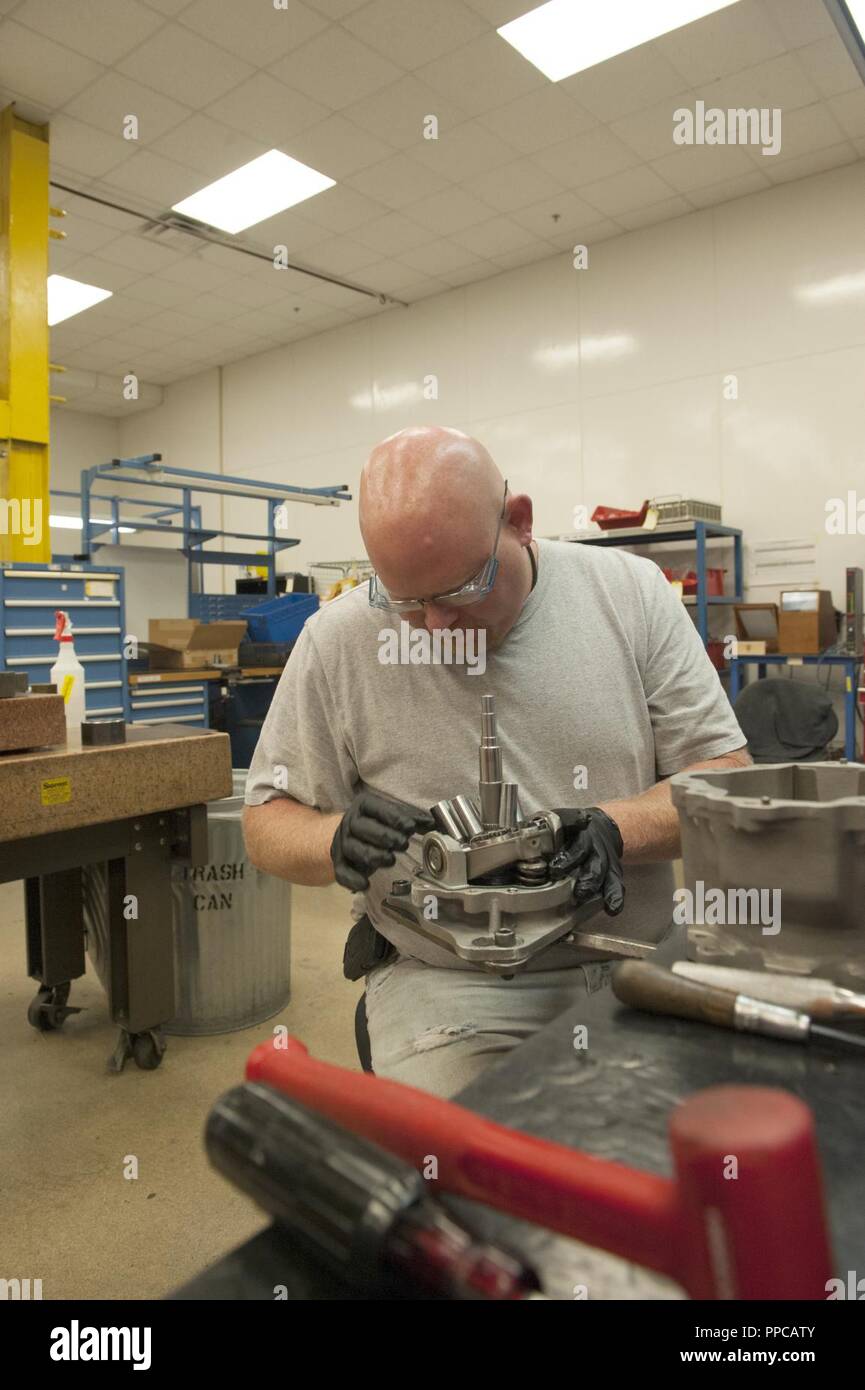 Billy Bryant, a pneudraulic systems mechanic, assembles a Vickers pump ...