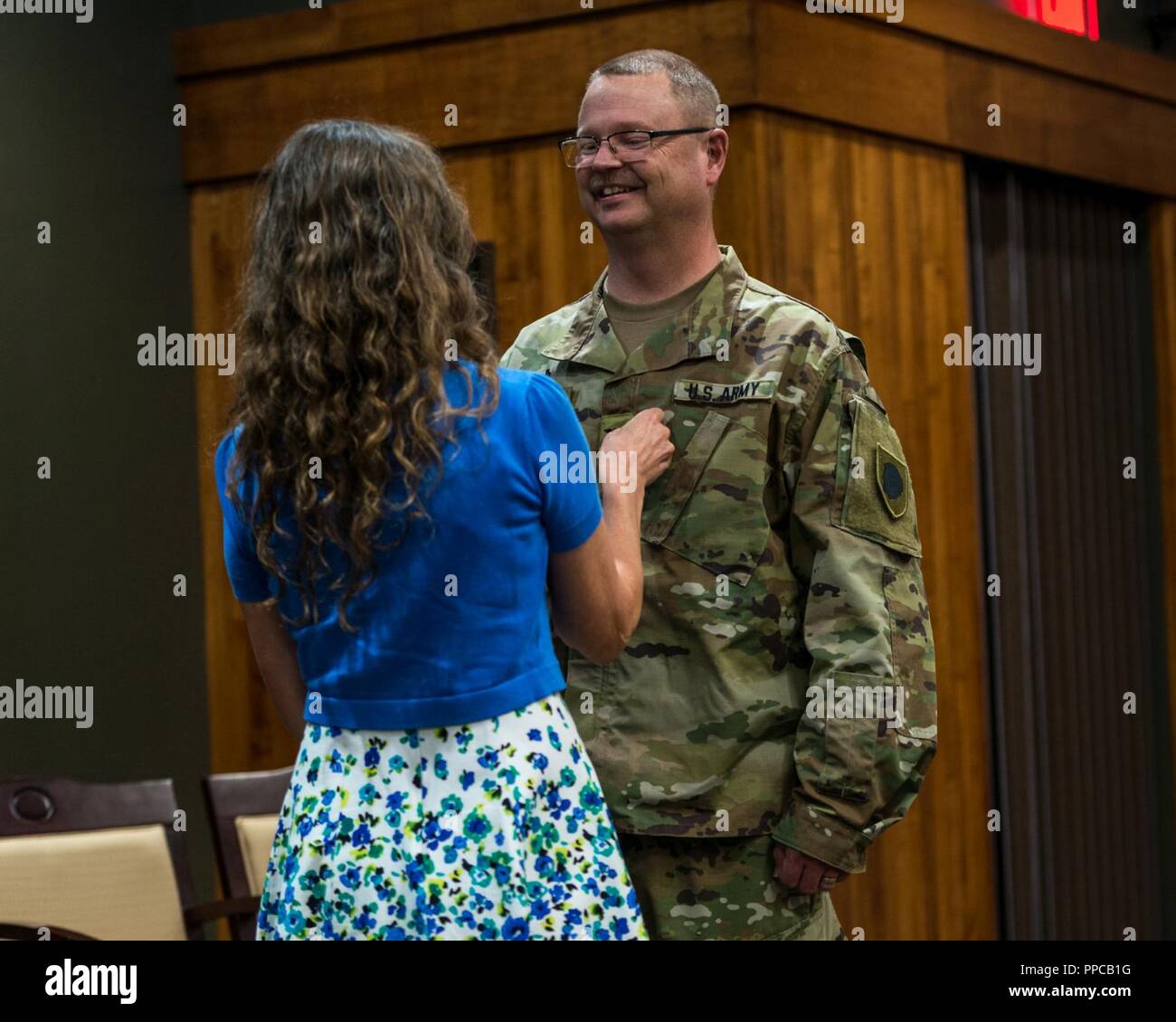 Debra Foster pins the rank of Colonel on her husband Chaplain Steve ...
