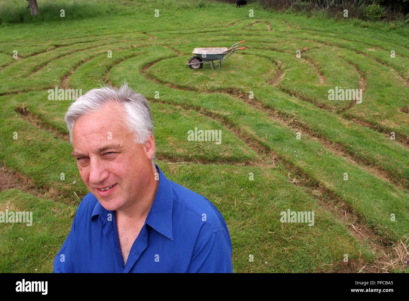 Andrew Fisher, maze designer and builder constructing a maze at his ...