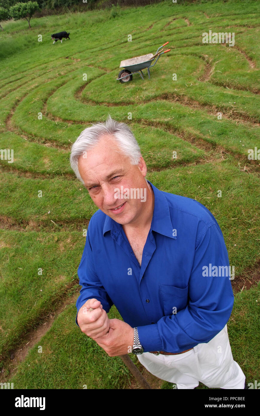 Andrew Fisher, maze designer and builder constructing a maze at his ...