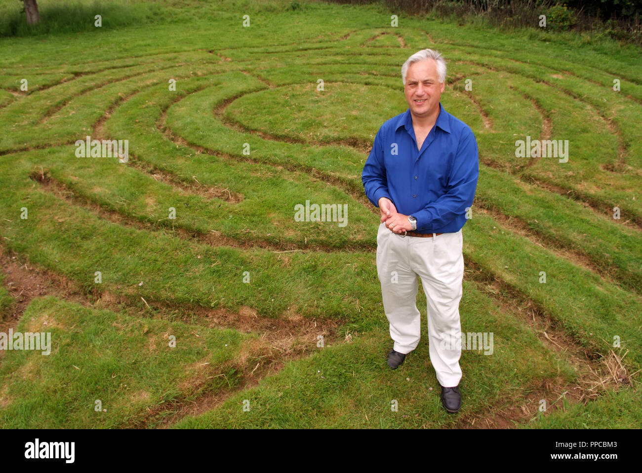 Andrew Fisher, maze designer and builder constructing a maze at his ...