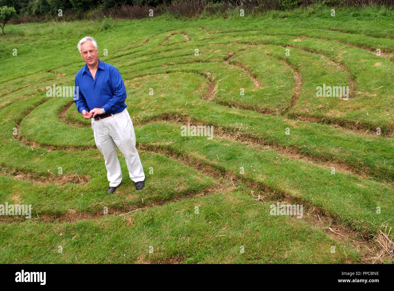 Andrew Fisher, maze designer and builder constructing a maze at his ...
