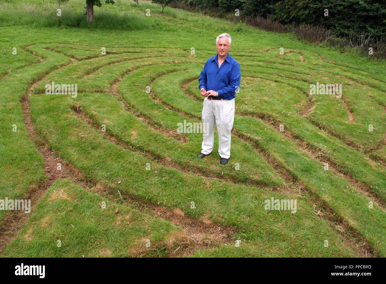 Andrew Fisher, maze designer and builder constructing a maze at his ...
