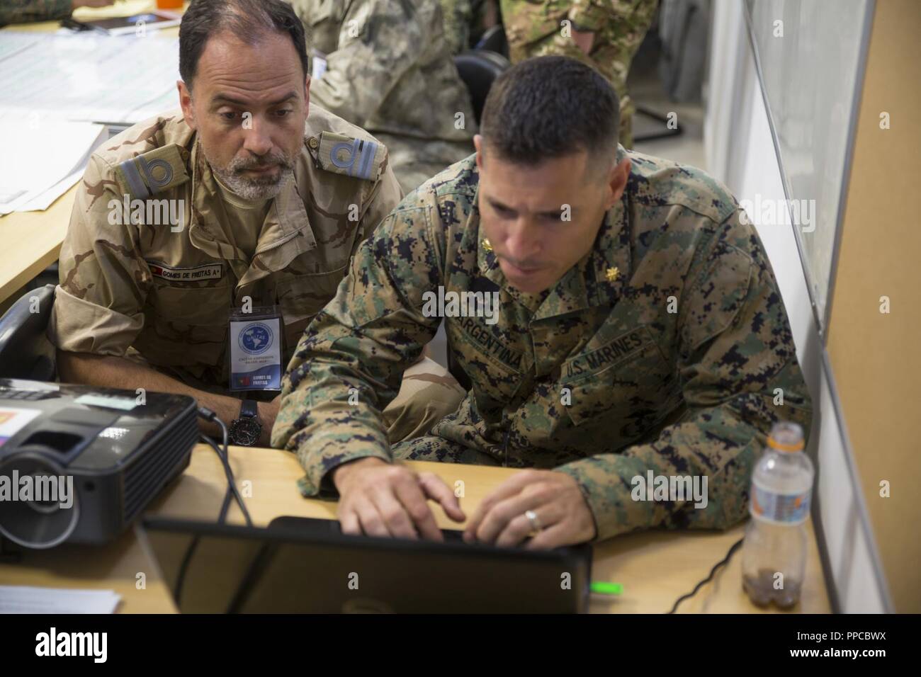 Portuguese Naval Infantry Lt. Cmdr. Bastian de Freitas works with U.S ...