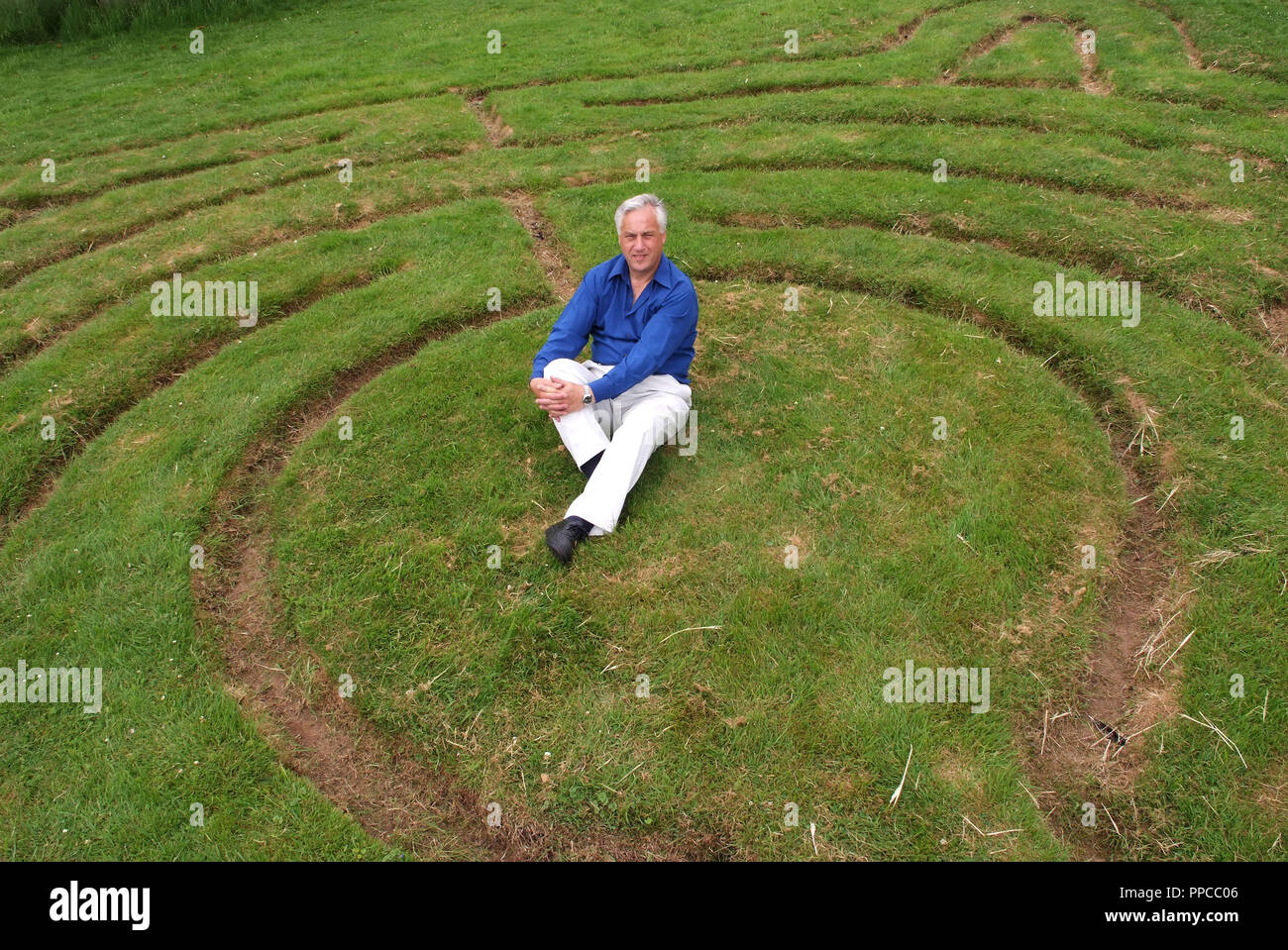 Andrew Fisher, maze designer and builder constructing a maze at his ...