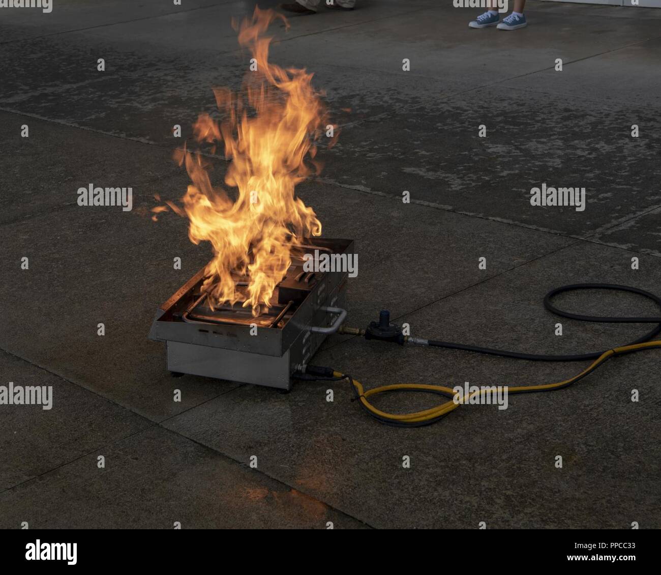 A controlled fire system ignites during a fire safety demonstration Aug ...