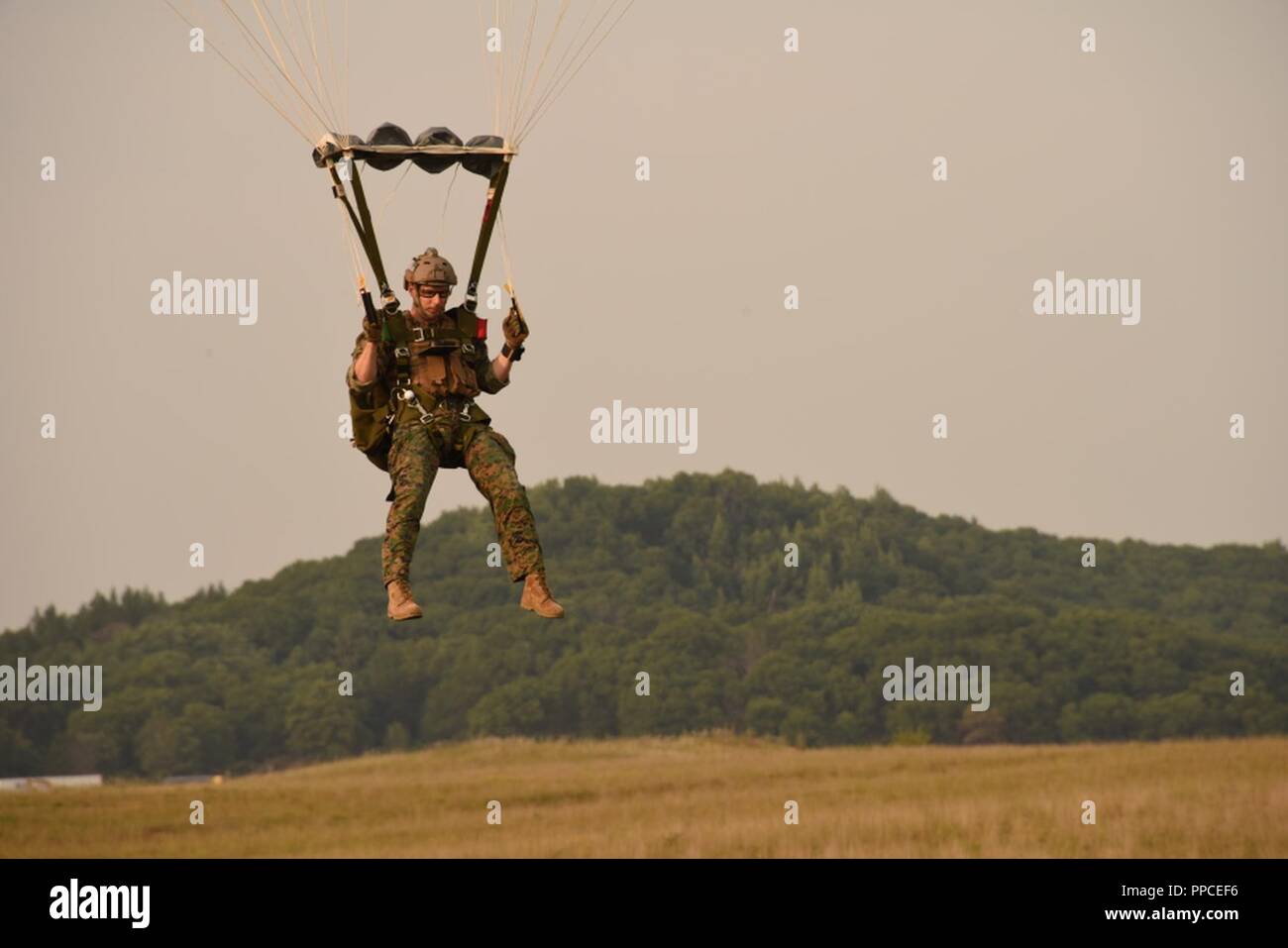 Marines perform a static line jump from an AC-130 at Fort McCoy, Wis ...