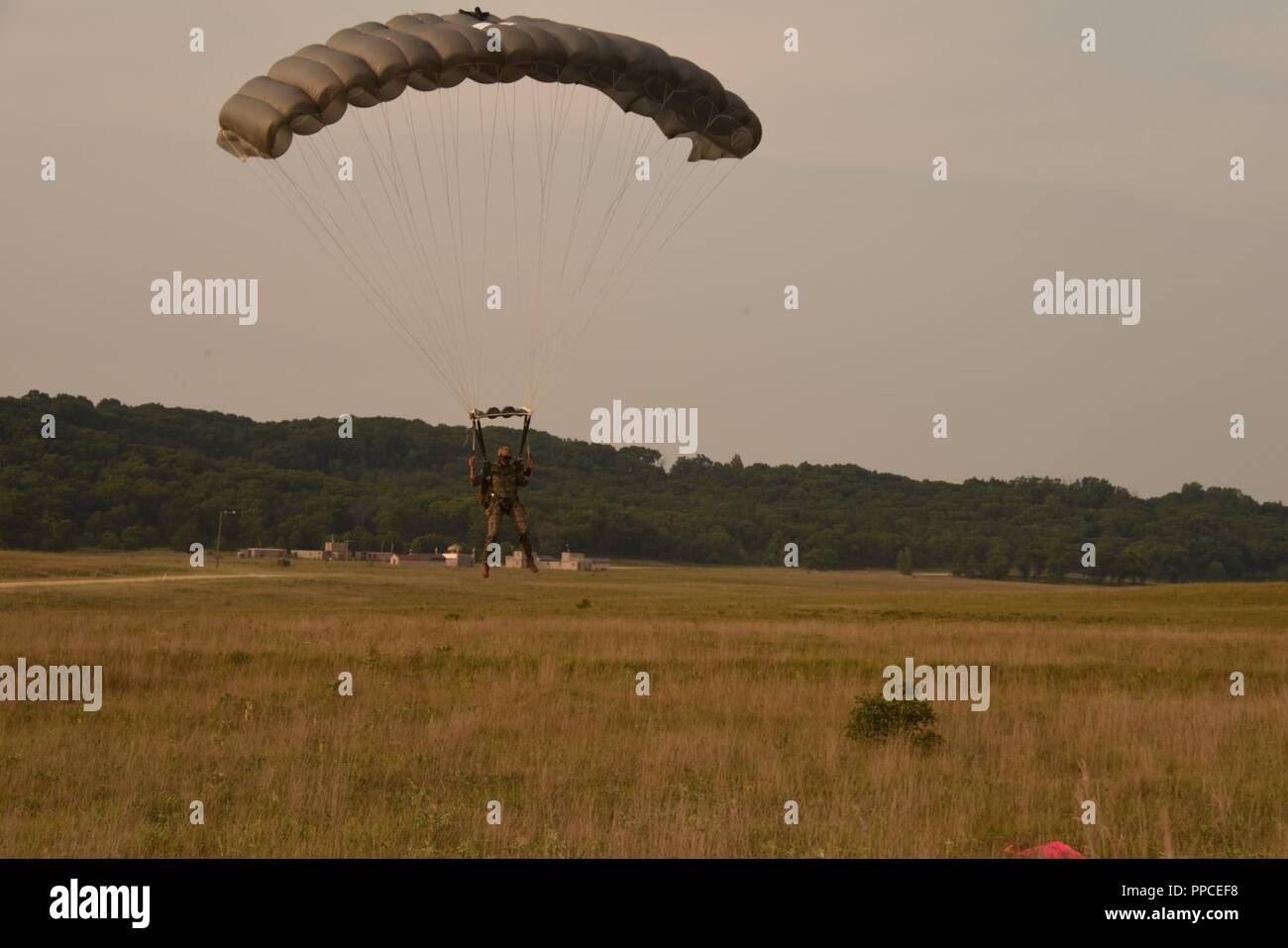 Marines perform a static line jump from an AC-130 at Fort McCoy, Wis ...