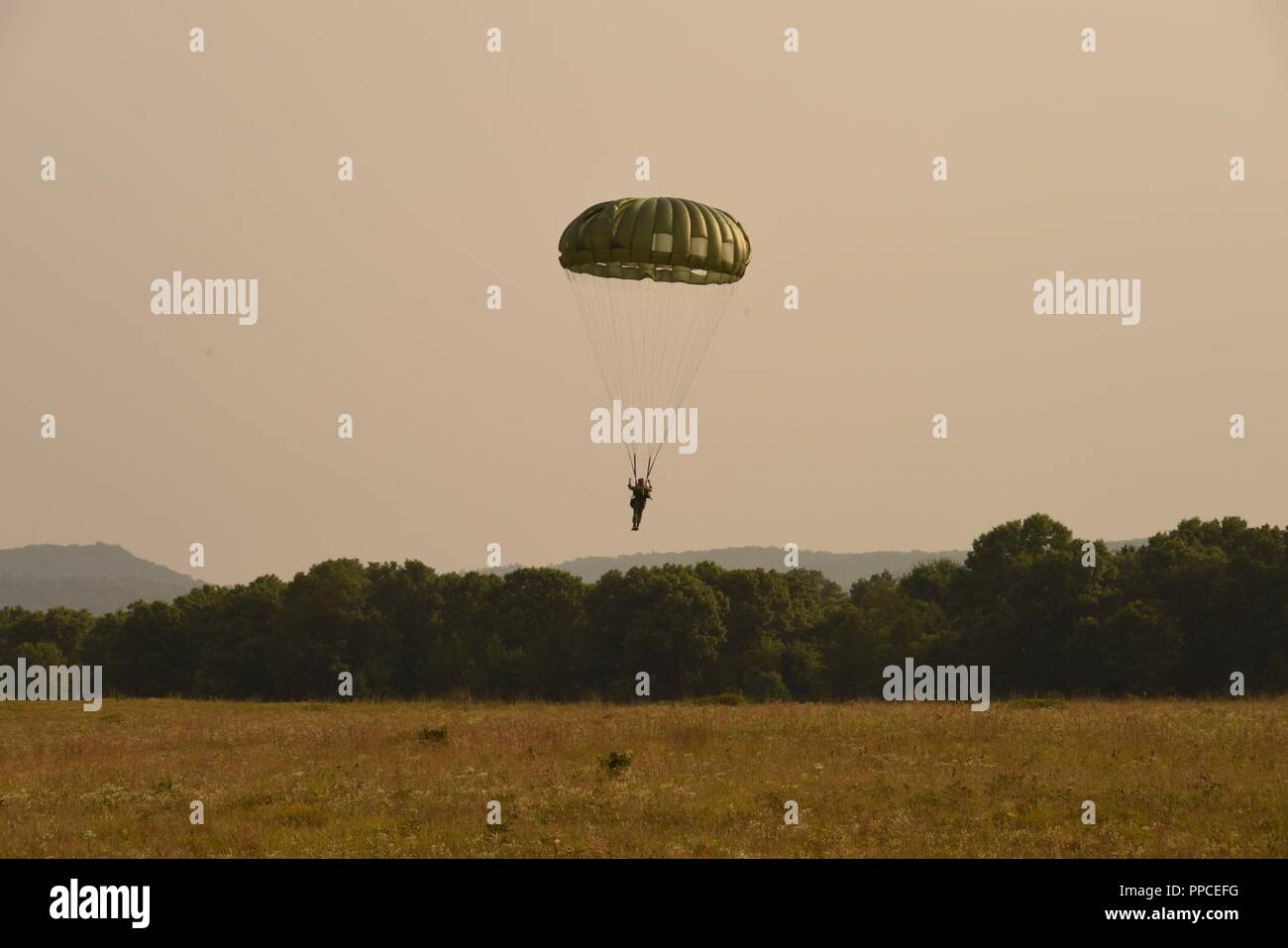 Marines perform a static line jump from an AC-130 at Fort McCoy, Wis ...