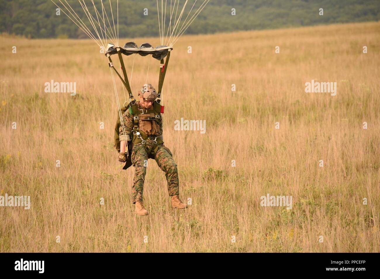 Marines perform a static line jump from an AC-130 at Fort McCoy, Wis ...