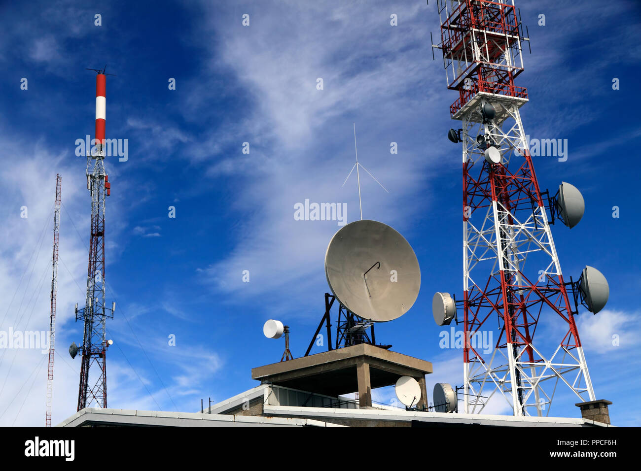 Several kind of communication antennas and a red and white tower Stock ...