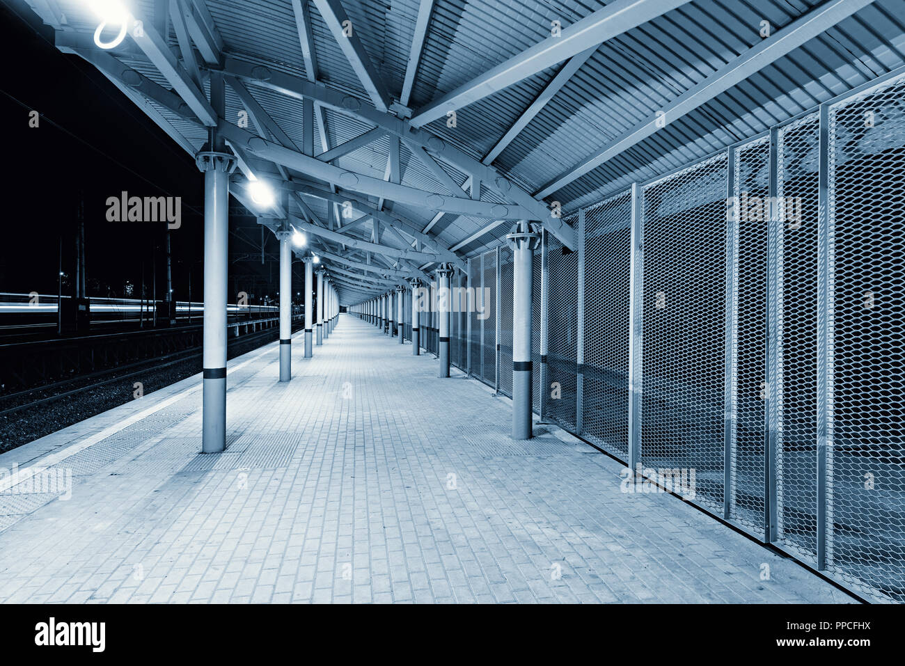 Night view of the station platform at night time Stock Photo - Alamy