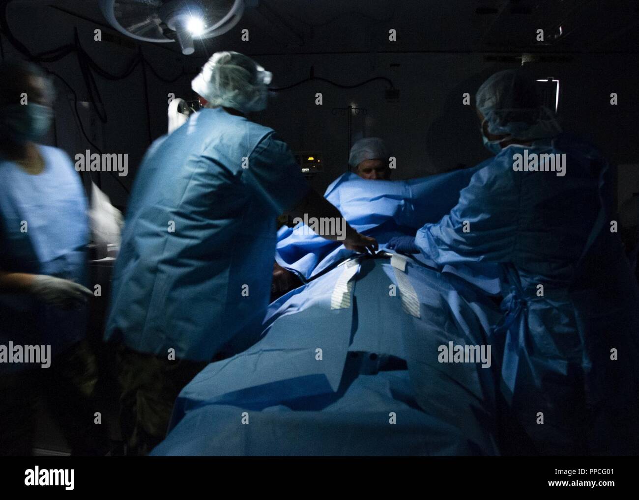 Soldiers with the 131st Field Hospital, 528th Hospital Center, assess a ...
