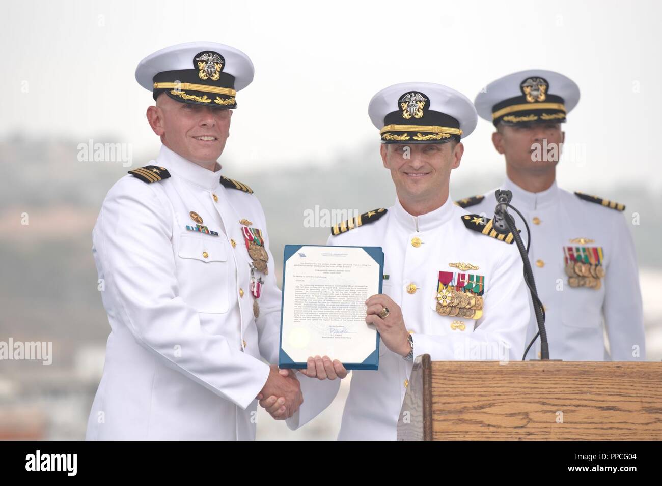 SAN DIEGO (Aug. 24, 2018) Capt. Chris Cavanaugh presents the ...