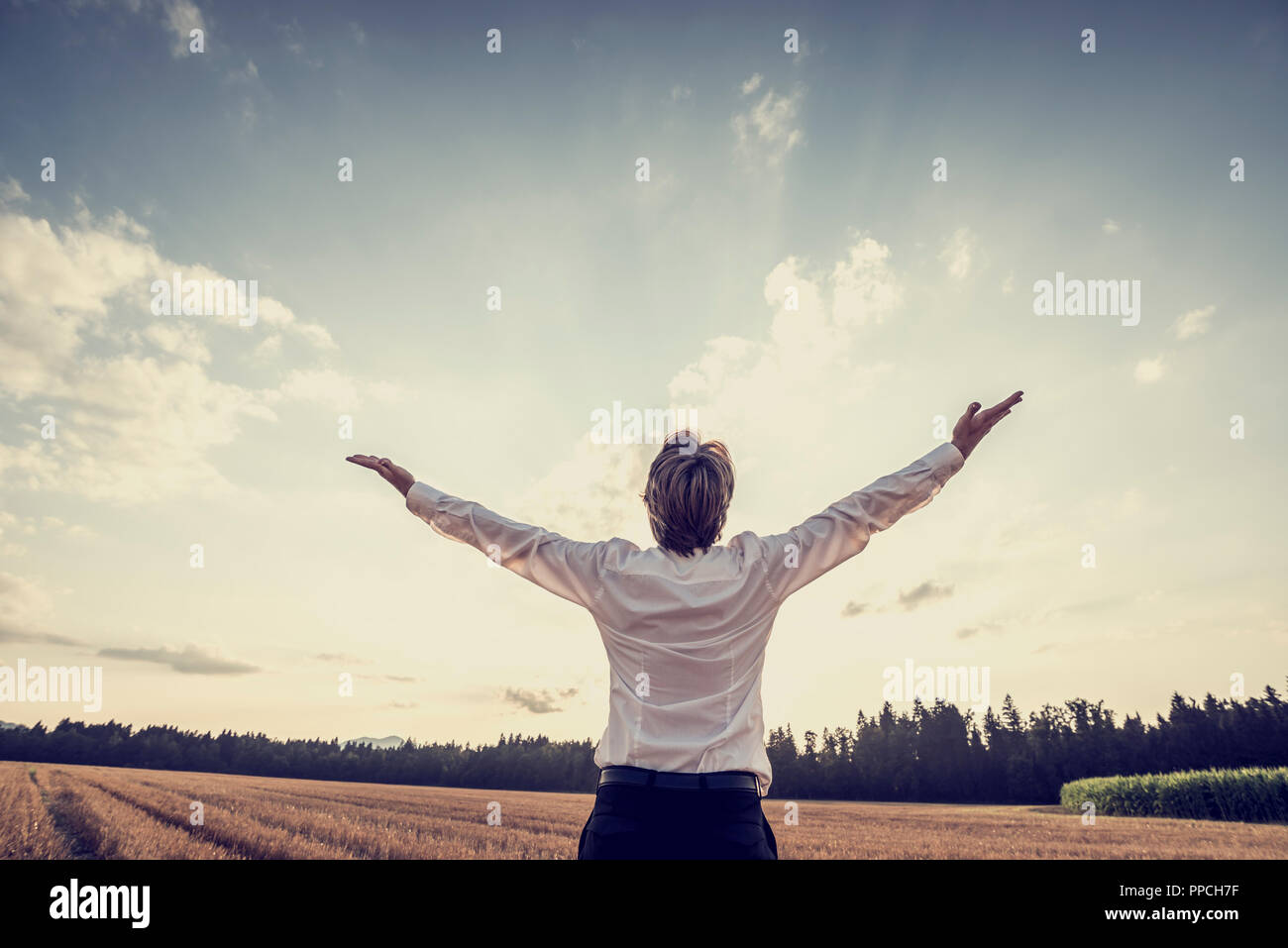 Retro image of victorious young businessman celebrating his success and ...