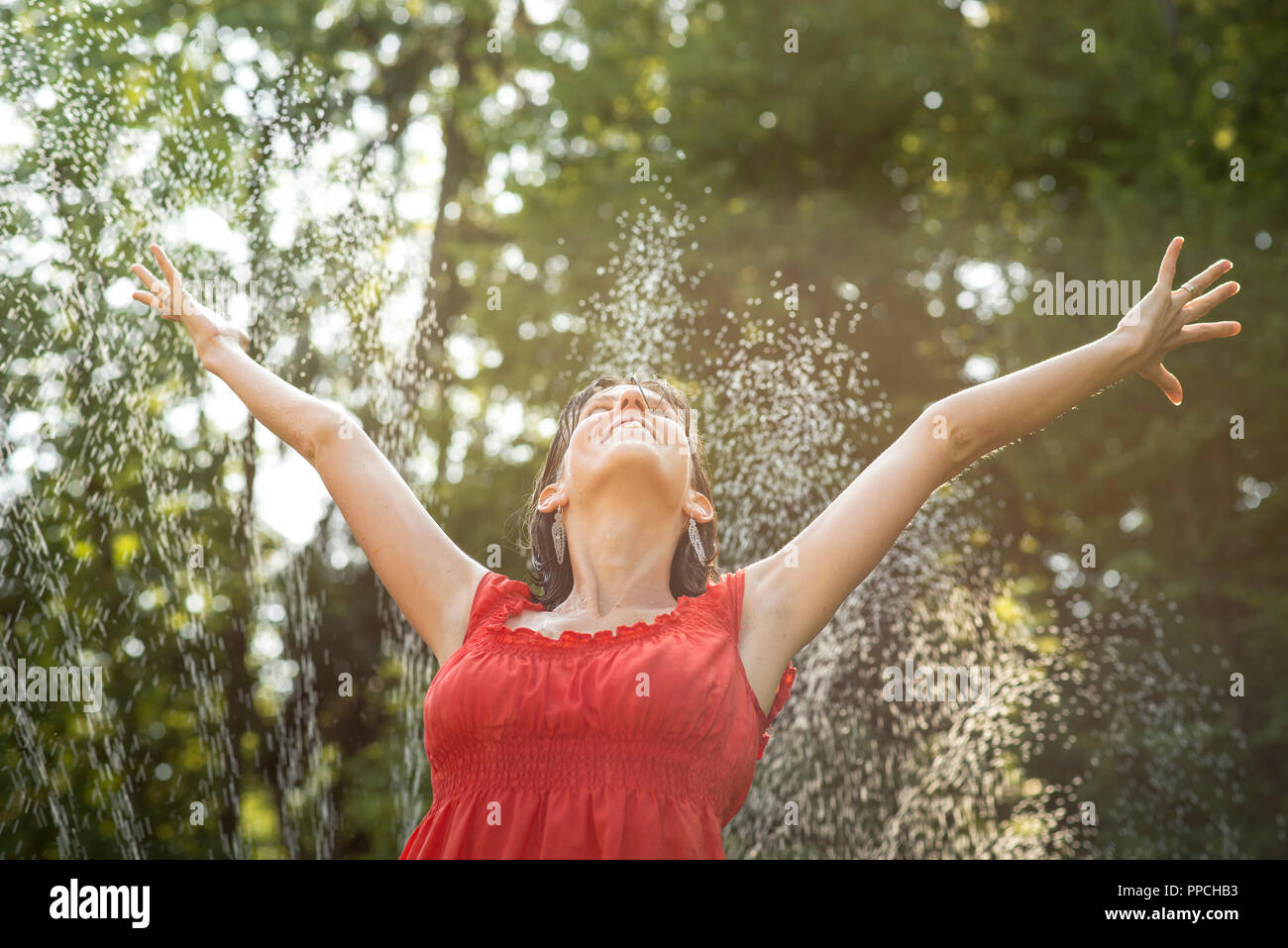 Girl under water jet hi-res stock photography and images - Alamy