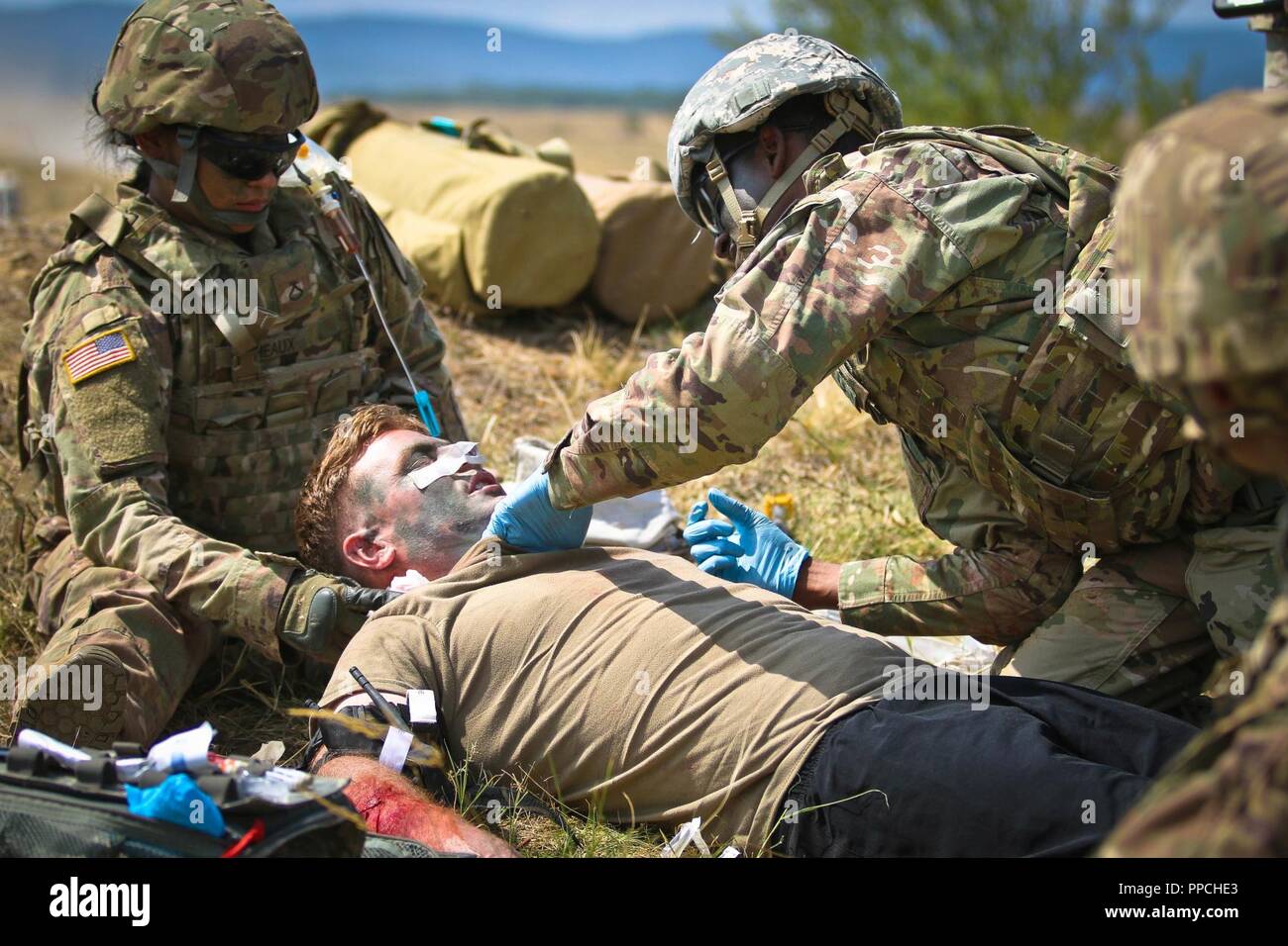 U.S. Army Pvt. Christian Avila, a combat medic assigned to Headquarters ...