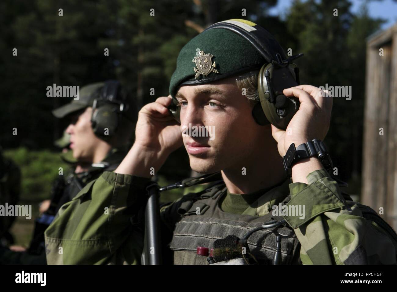 A Swedish Coastal Ranger with 1st Marine Regiment waits to conduct a ...