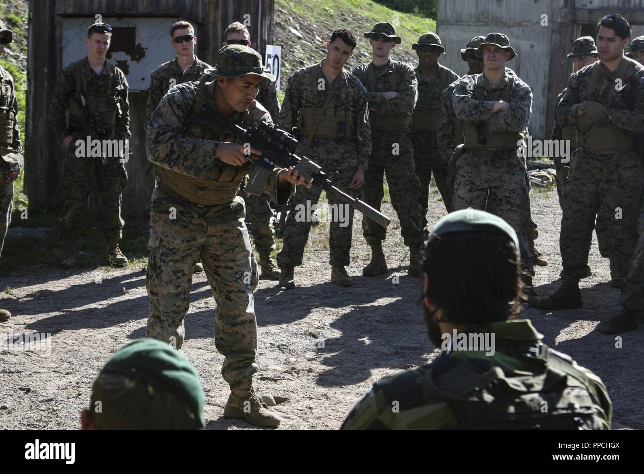 A U.S. Marine with Marine Rotational Force-Europe 18.1 demonstrates how ...