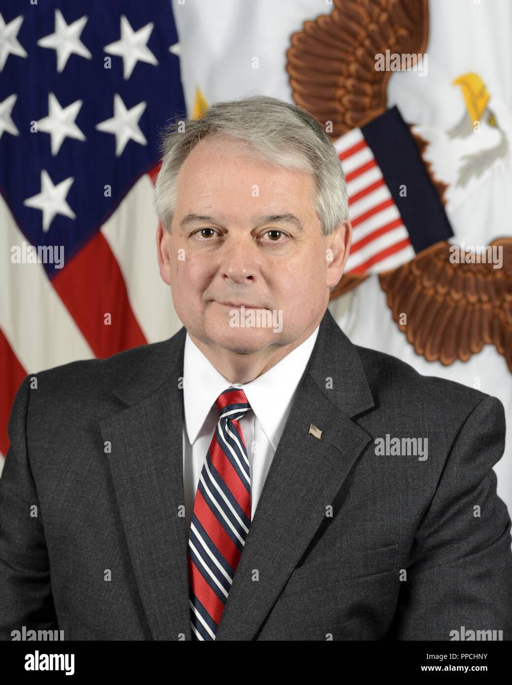 Paul C. Ney, Jr., Department of Defense General Counsel, poses for his ...