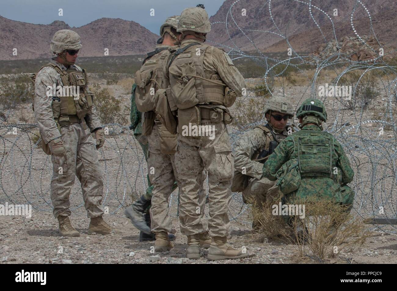 U.S. Marines with 1st Combat Engineer Battalion, observe Soldiers from ...