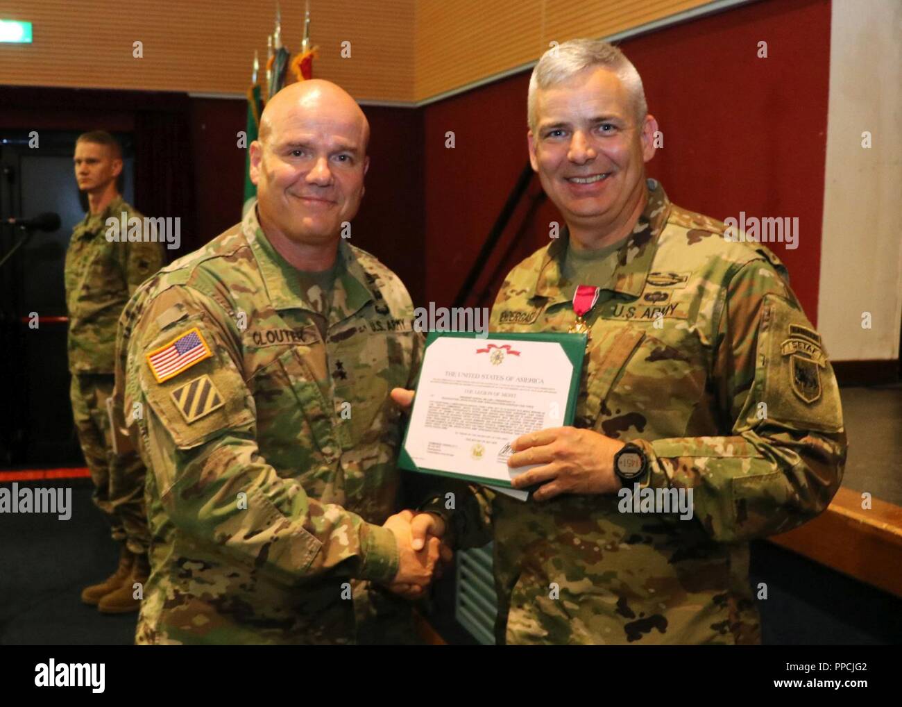 Maj. Gen. Roger Cloutier, U.S. Army Africa Commanding General, presents ...