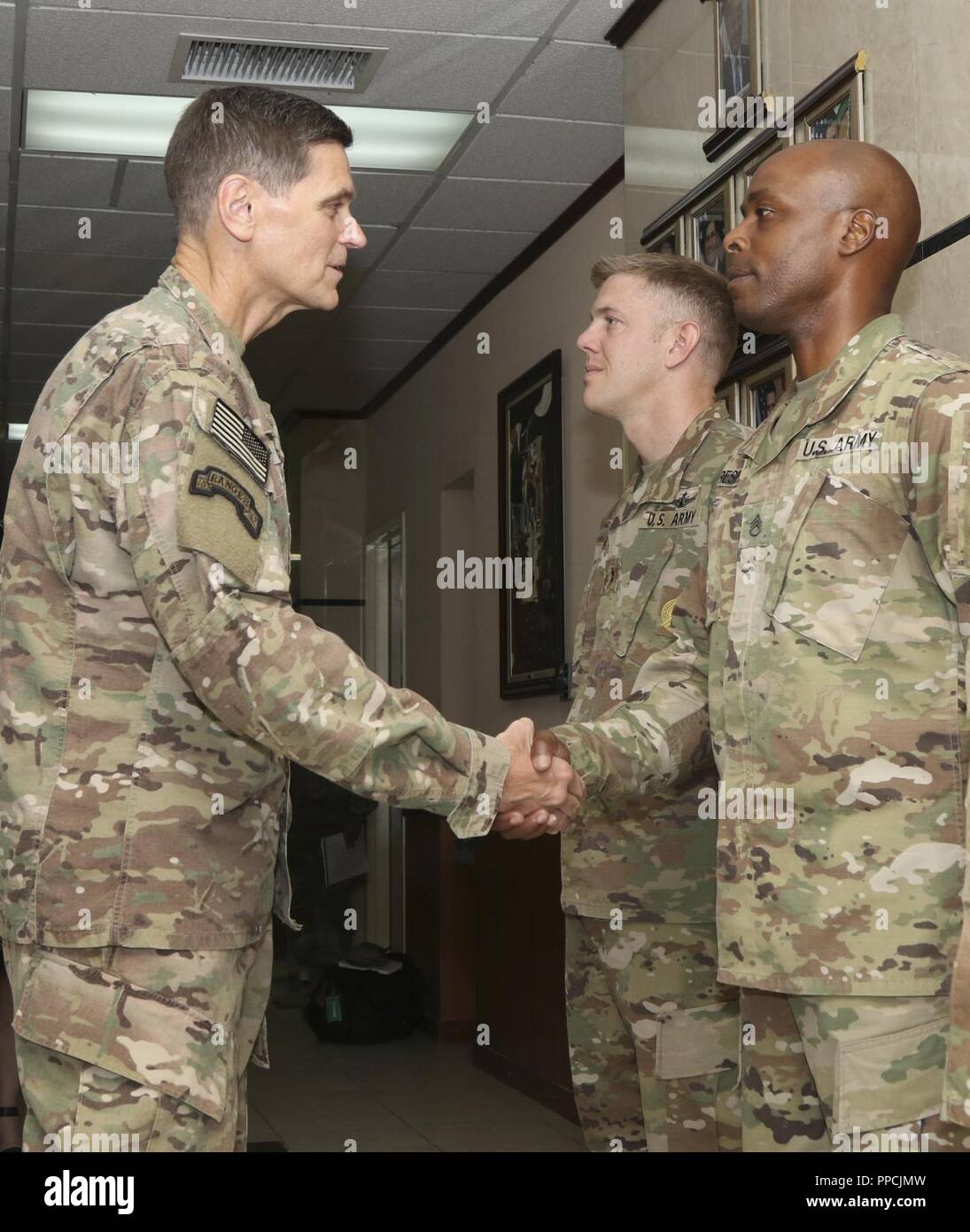 U.S. Army Gen. Joseph Votel, U.S. Central Command commander, presents a ...