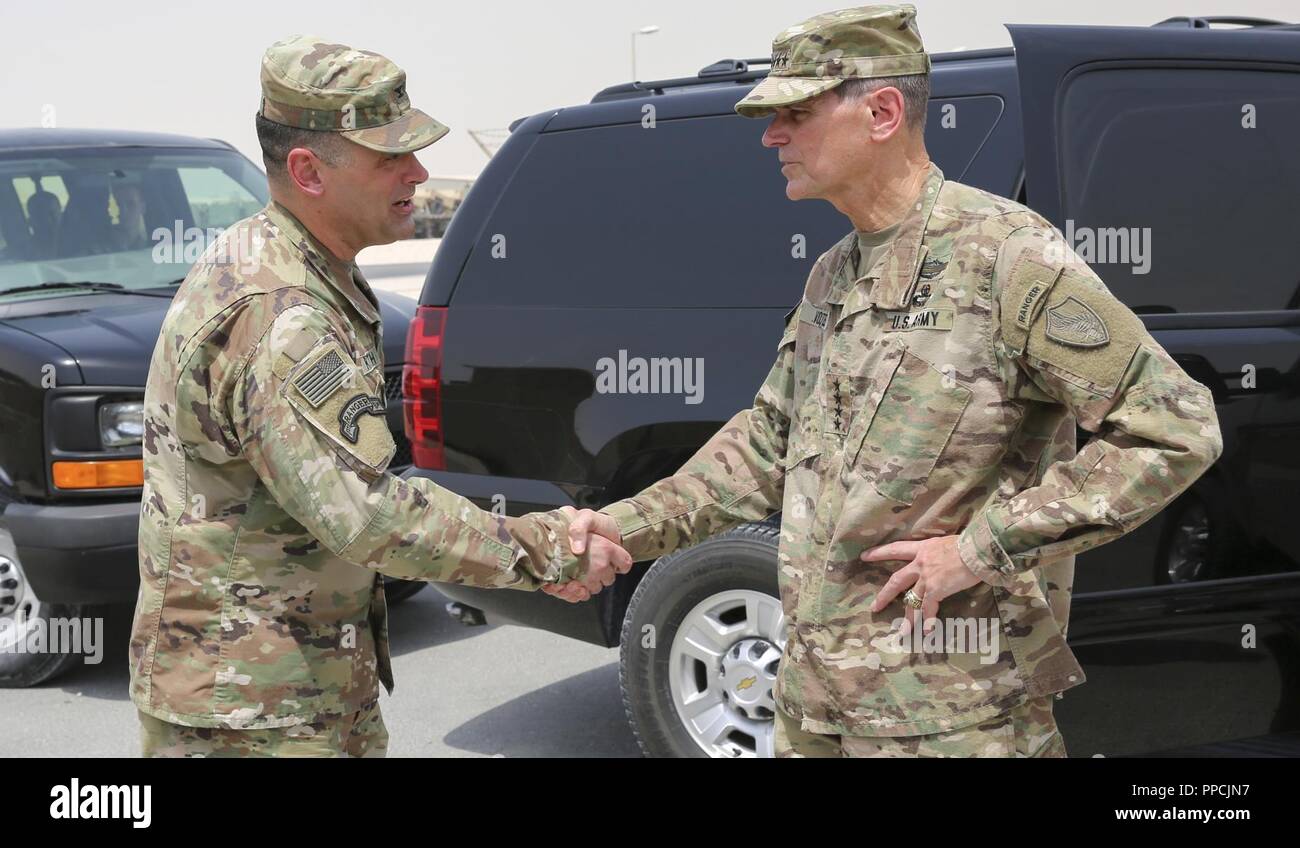U.S. Army Col. Robert Kuth, Area Support Group-Qatar commander, greets ...
