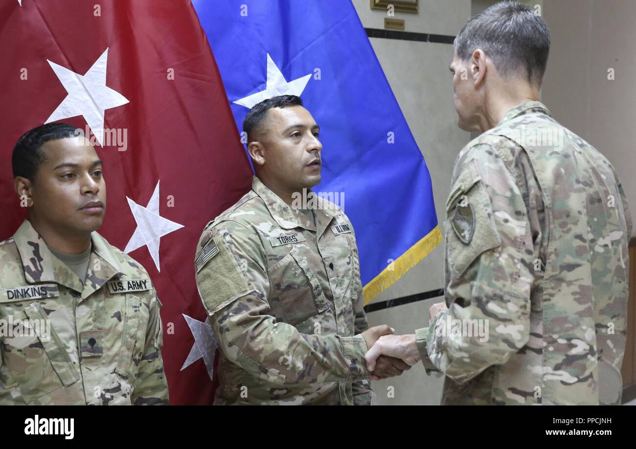 U.S. Army Gen. Joseph Votel, U.S. Central Command commander, presents a ...
