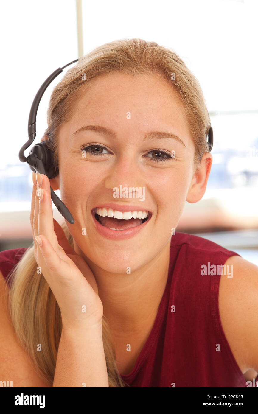 Portrait of smiling young telemarketer inside office building Stock ...