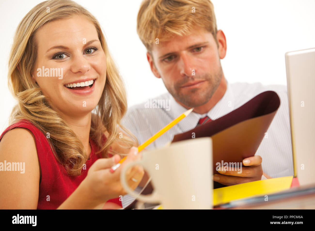 Business colleagues going over paperwork Stock Photo - Alamy
