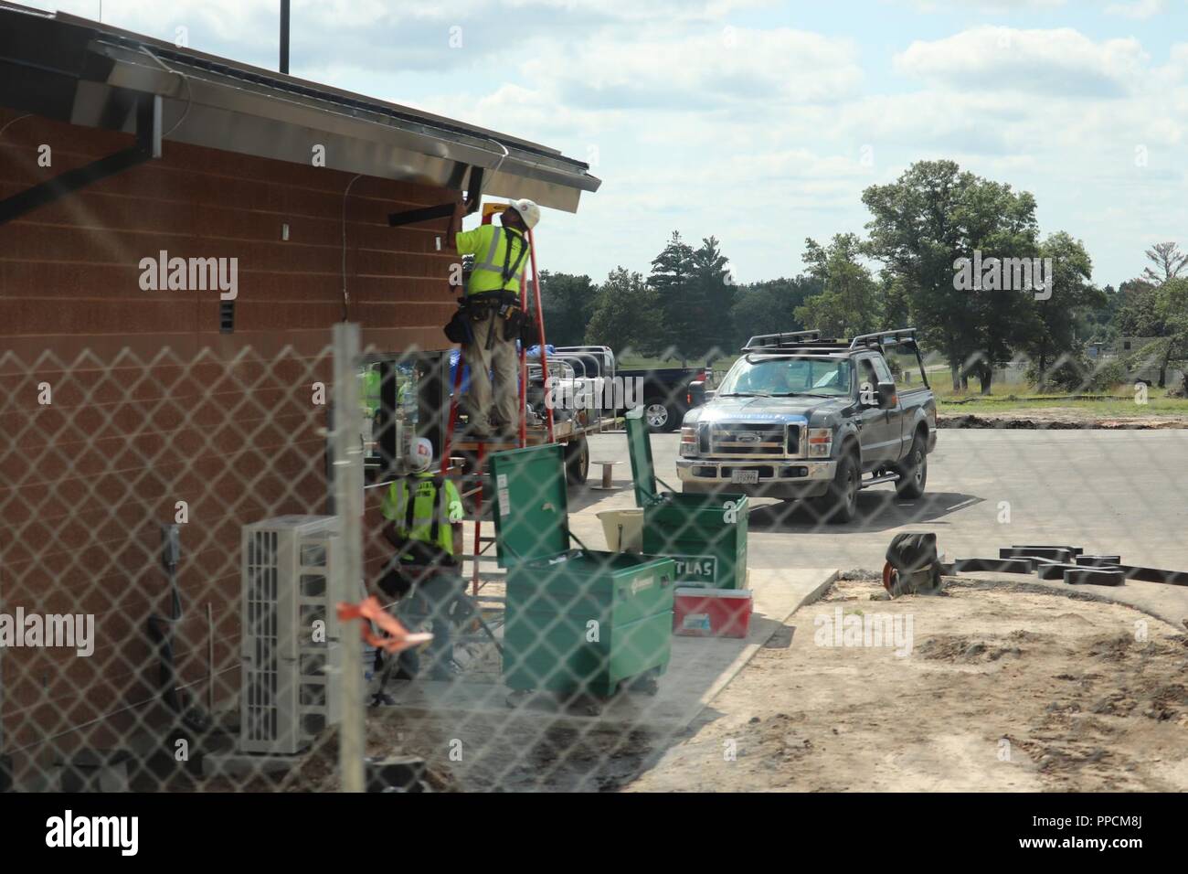 Workers with Catamount Constructors, Inc. of Lakewood, Colo., continue ...
