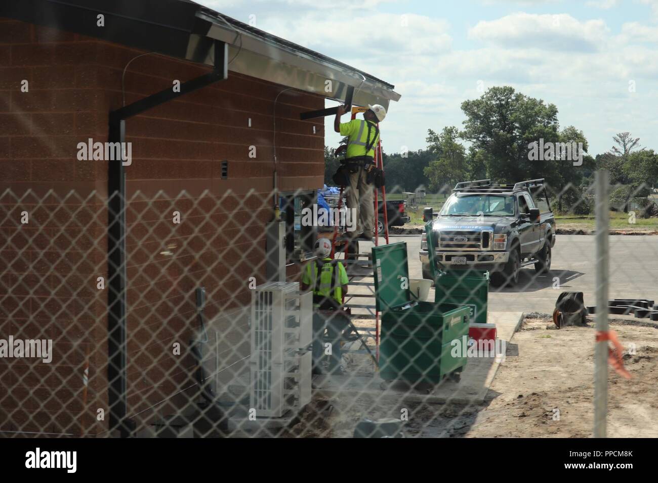Workers with Catamount Constructors, Inc. of Lakewood, Colo., continue ...