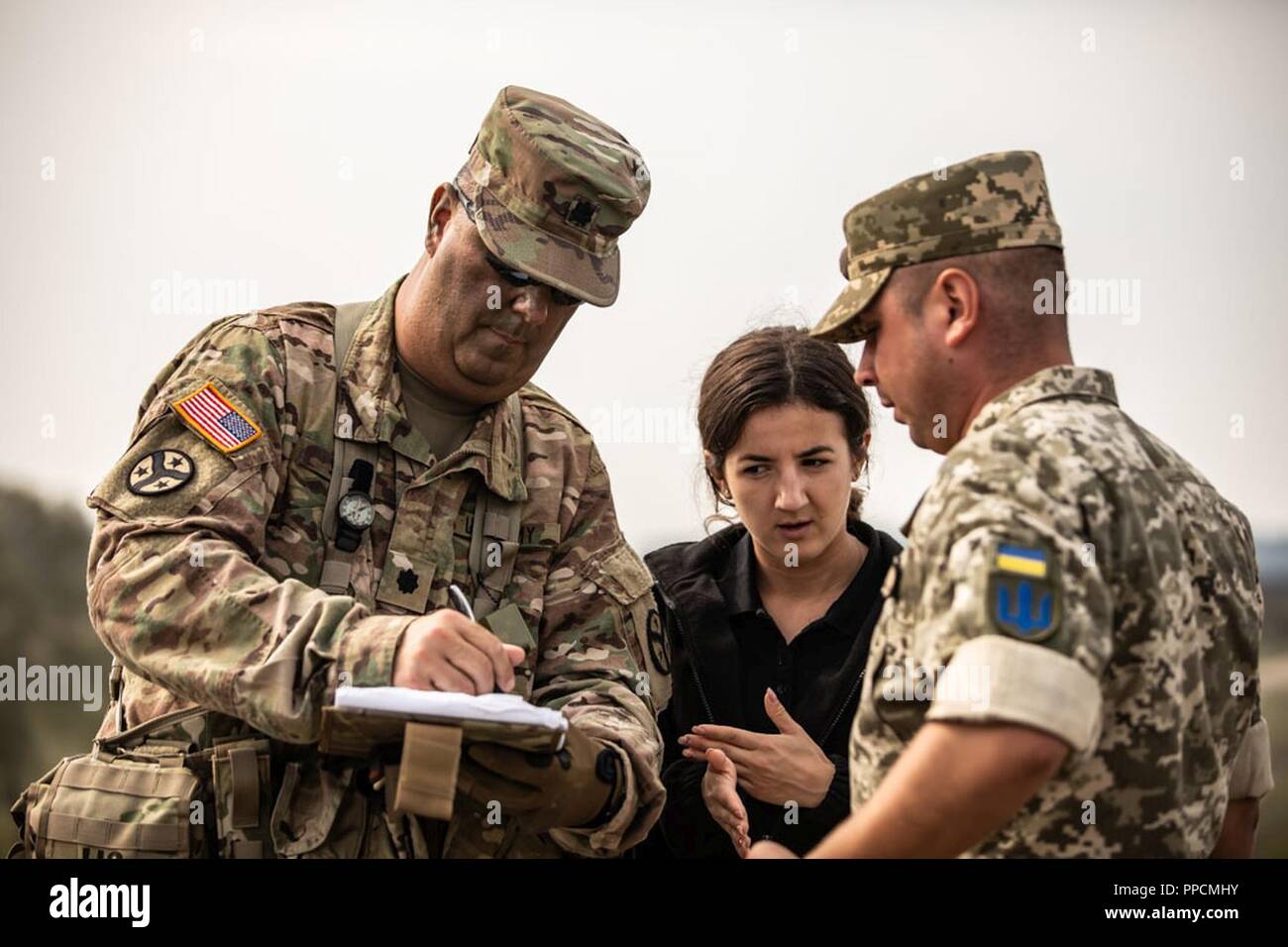 Lt. Col. Matthew Smith of the Tennessee Army National Guard speaks with ...
