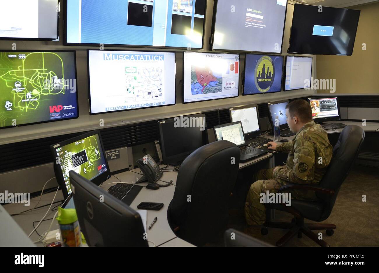 Capt. Seth Hayden of the Army Cyber Protection Brigade monitors ...