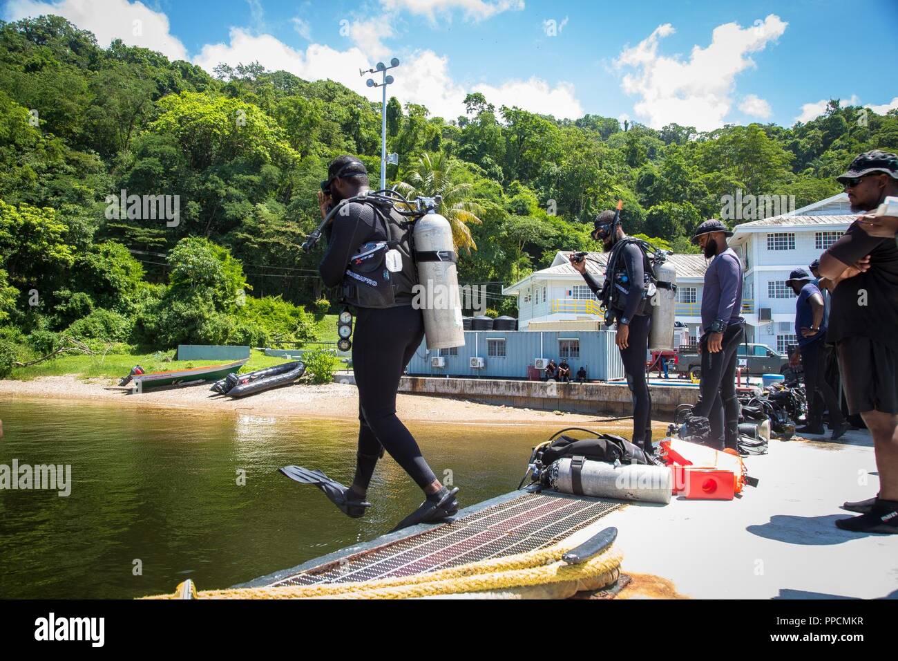 A member of the Trinidad and Tobago Coast Guard dive team conducts a ...