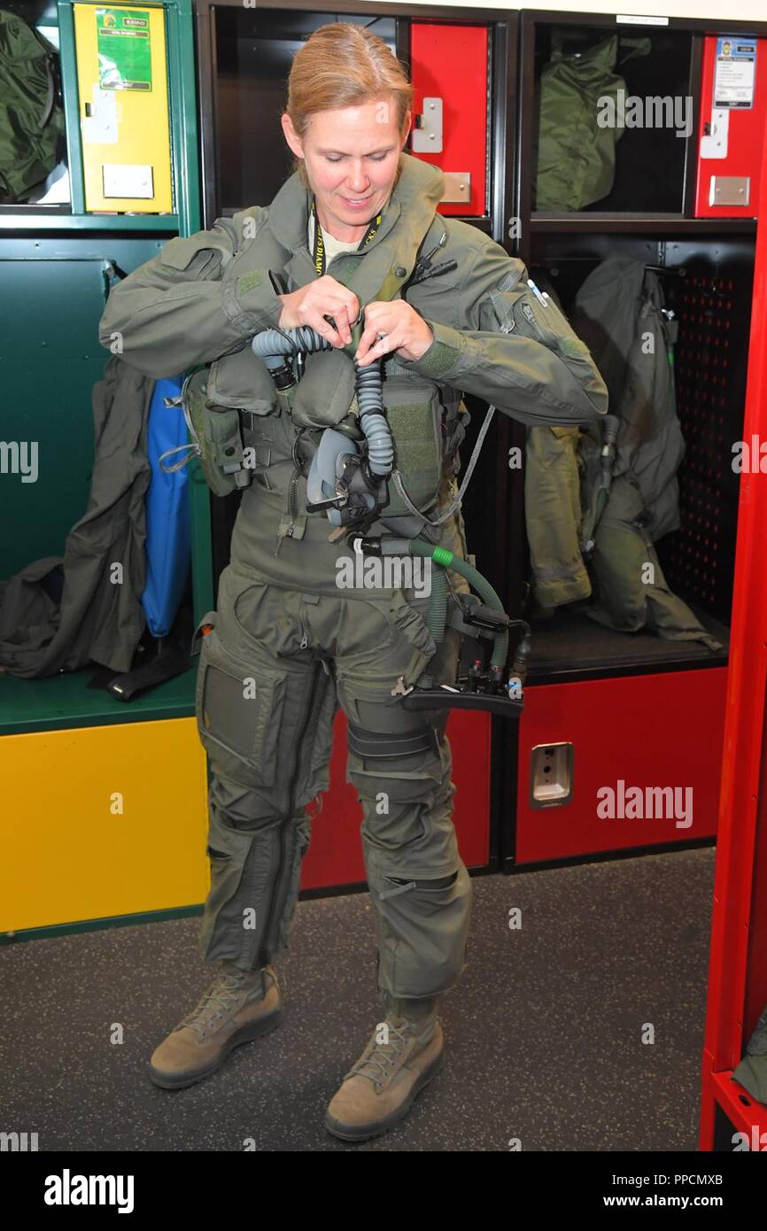 Col. Gina "Torch" Sabric, commander of the 419th Fighter Wing, suits up ...