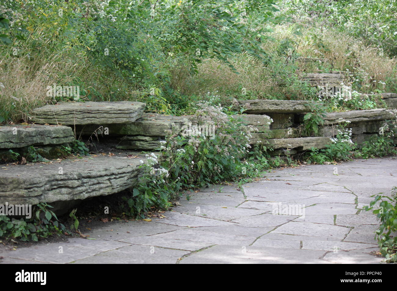 The stacked rocks and limestone paths of a charming park Stock Photo ...