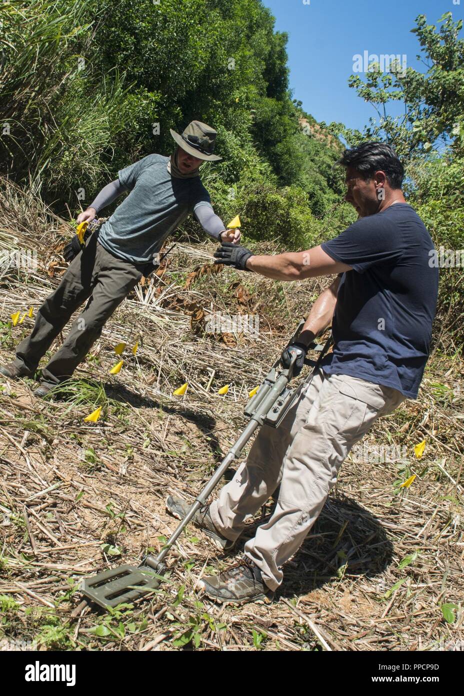 U.S. Marine Corps Master Sgt. Michael Whitener, right, an explosive ...