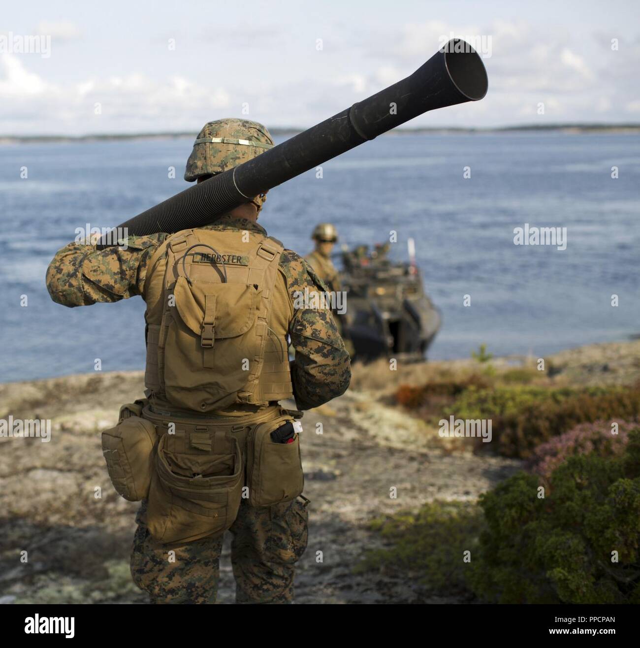 A mortarman with Marine Rotational Force - Europe 18.1 carries an 81mm ...