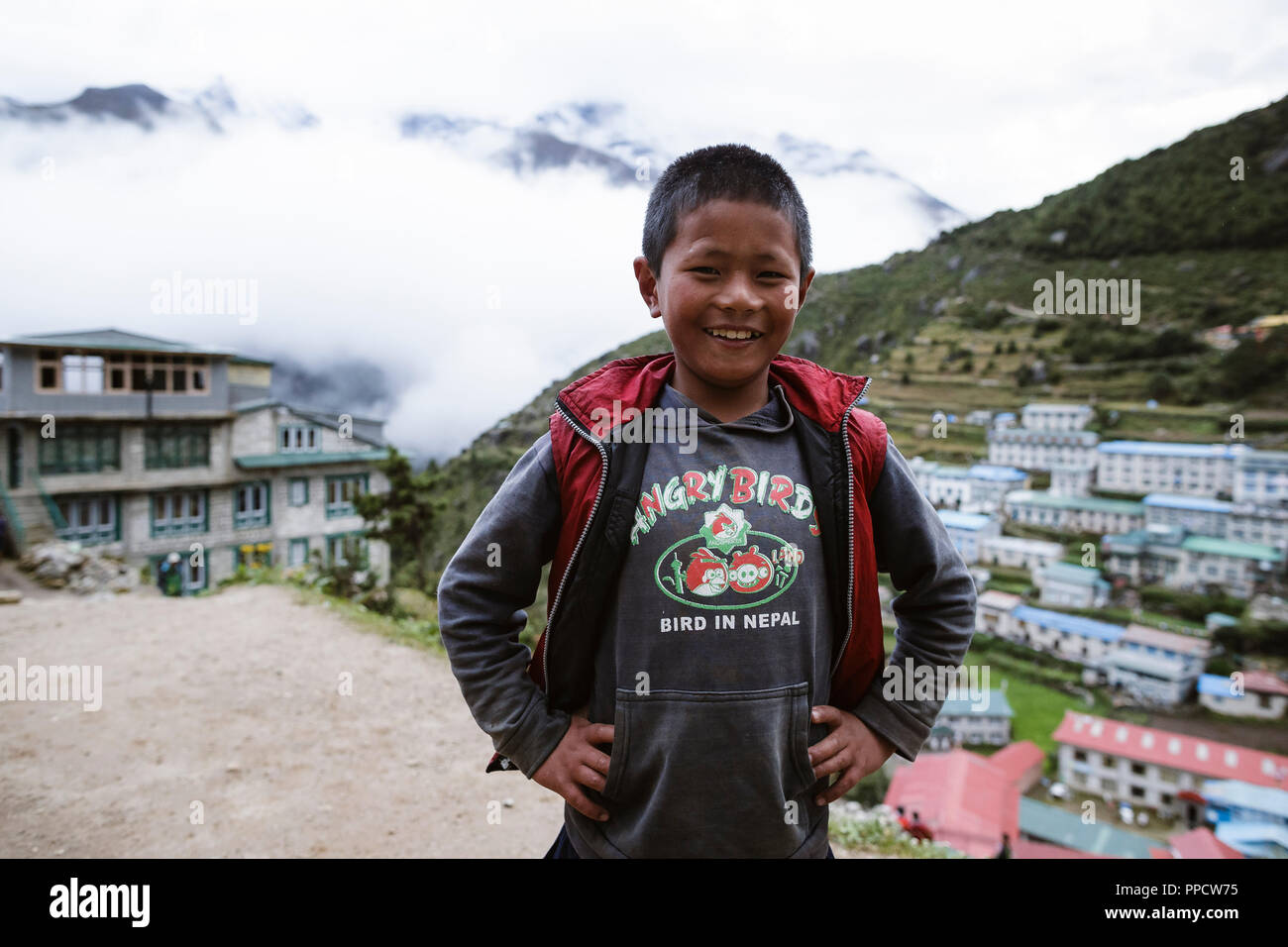 A young Nepalese boy stands for a photo in Namche Bazaar, the Solu ...