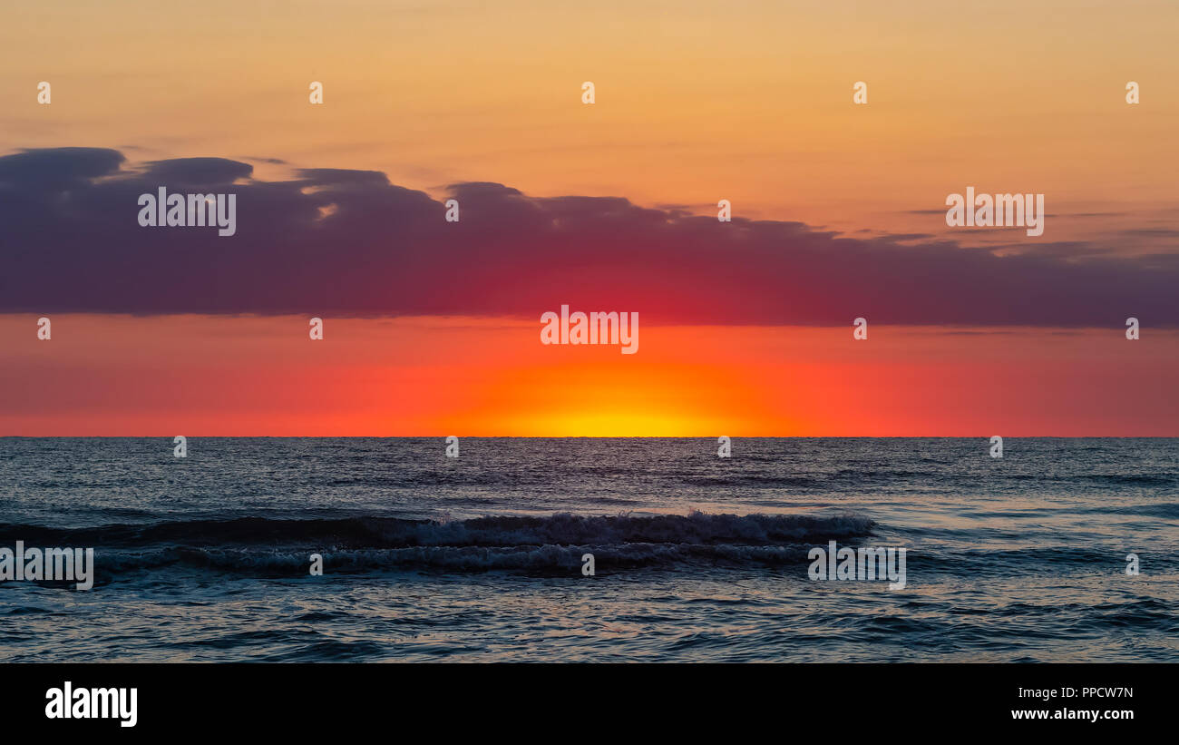 Amazing beautiful sunrise at the sea Stock Photo - Alamy