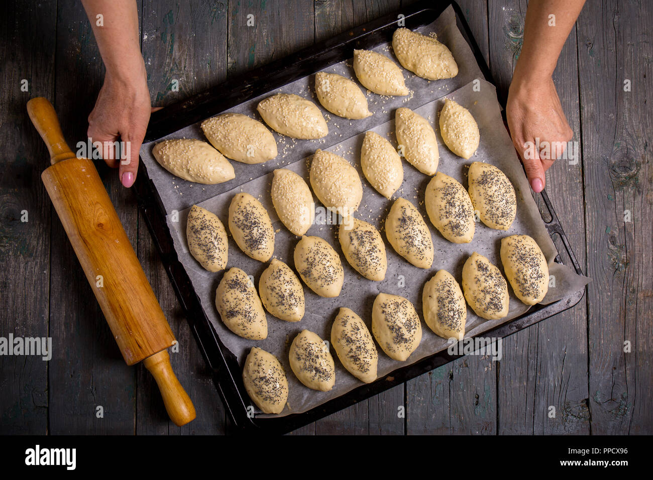 Baker holds baking sheet hi-res stock photography and images - Alamy
