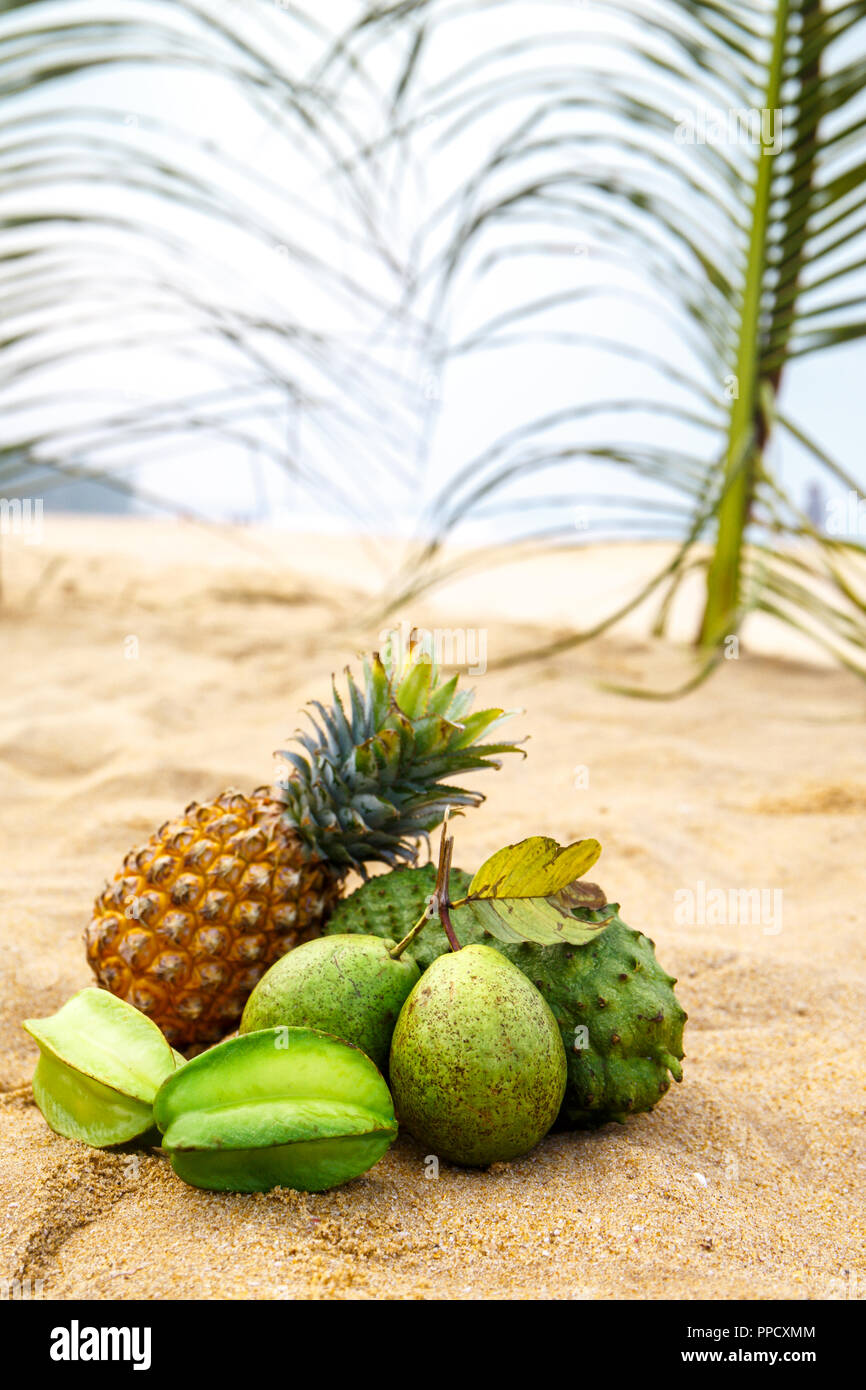 Exotic fruits on the sand near the ocean Stock Photo - Alamy